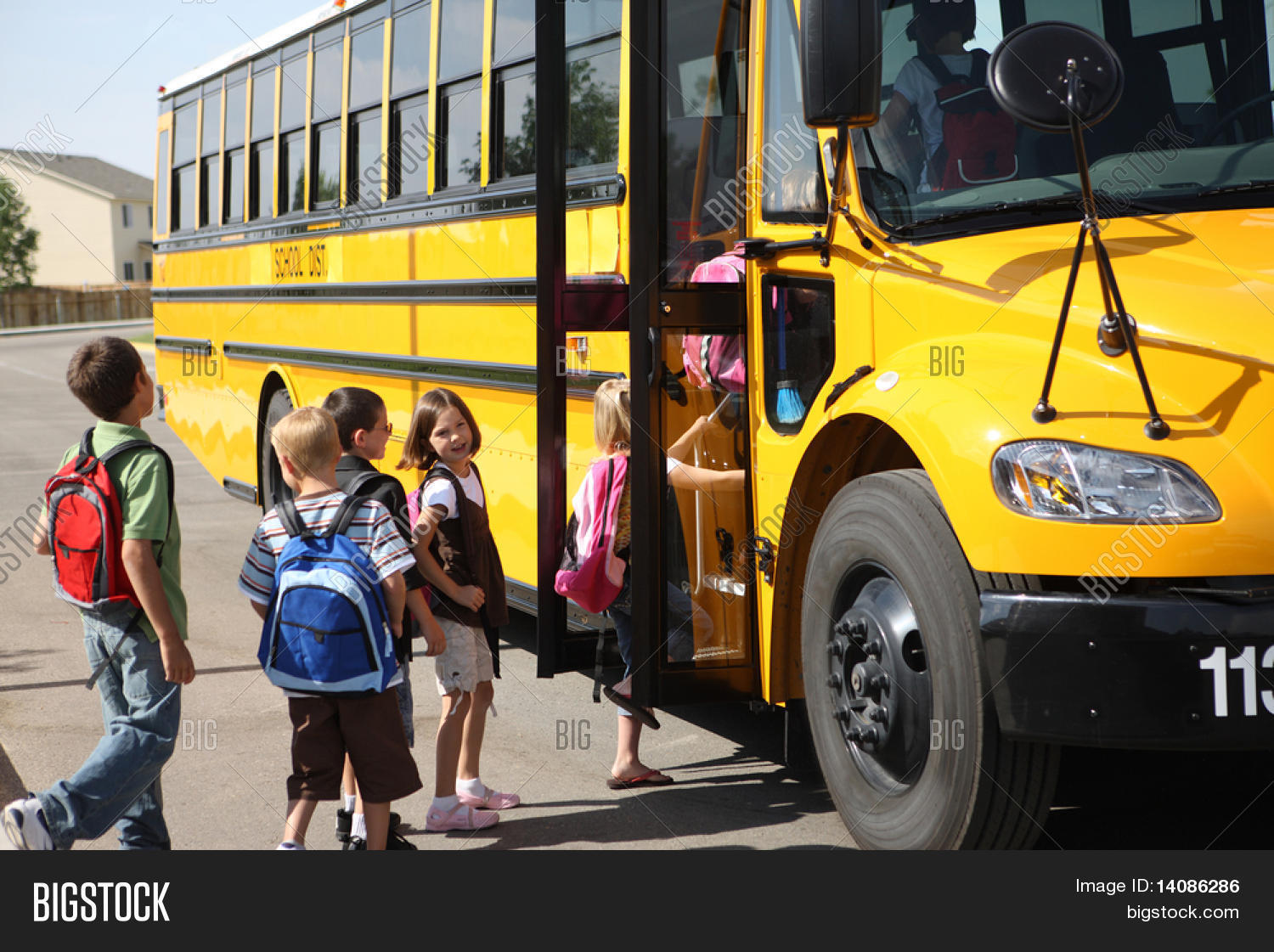 Elementary school students get on school bus Stock Photo & Stock Images ...