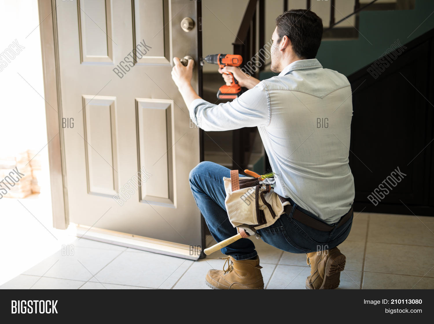 Young Man Fixing Door Image & Photo (Free Trial) | Bigstock