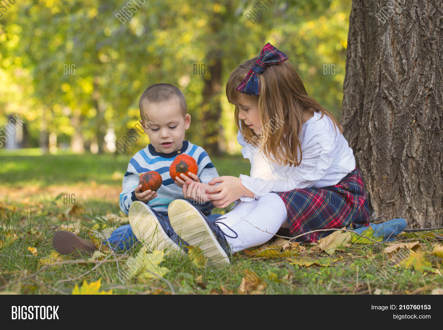 Little Boy And Girl Playing Outside