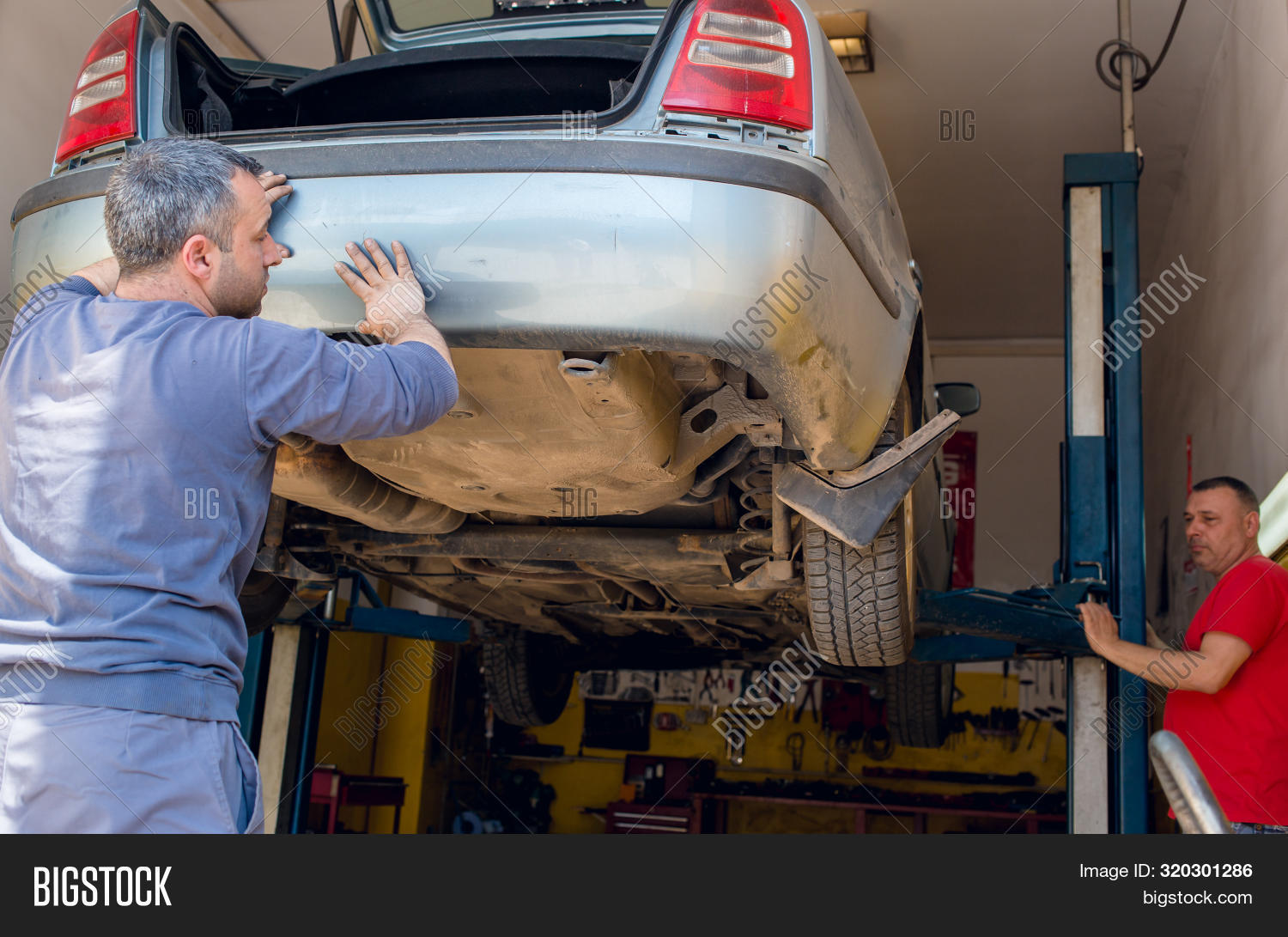 Car Mechanics Working Image & Photo (Free Trial) | Bigstock