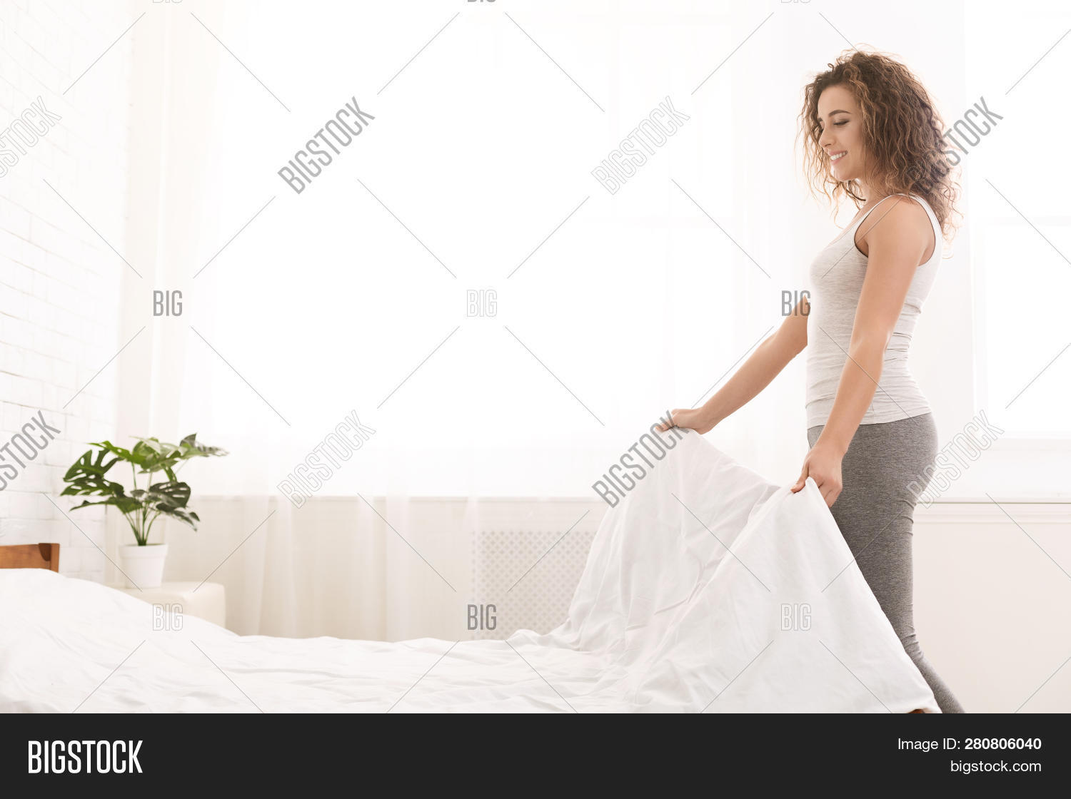 Young Woman Making Bed Image & Photo (Free Trial) | Bigstock
