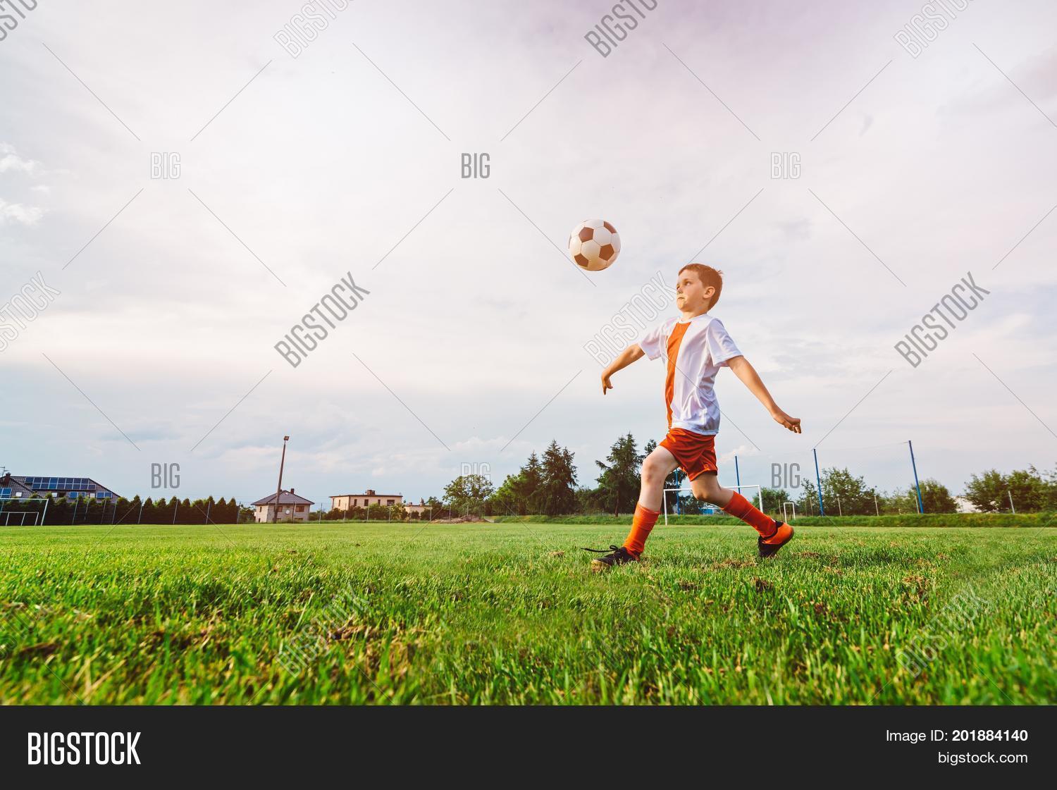 Boy Playing Football Image & Photo (Free Trial) | Bigstock