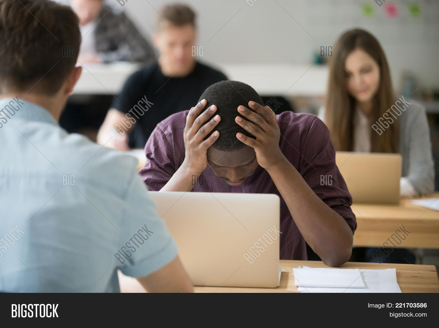 Frustrated Office Worker At Desk
