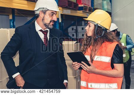 Warehouse Senior Manager Discuss With Worker In The Storehouse ...