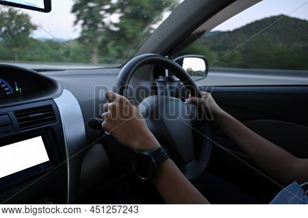 Photo Of Driver Hand On The Steering Wheel In Moving Vehicle. Don't ...