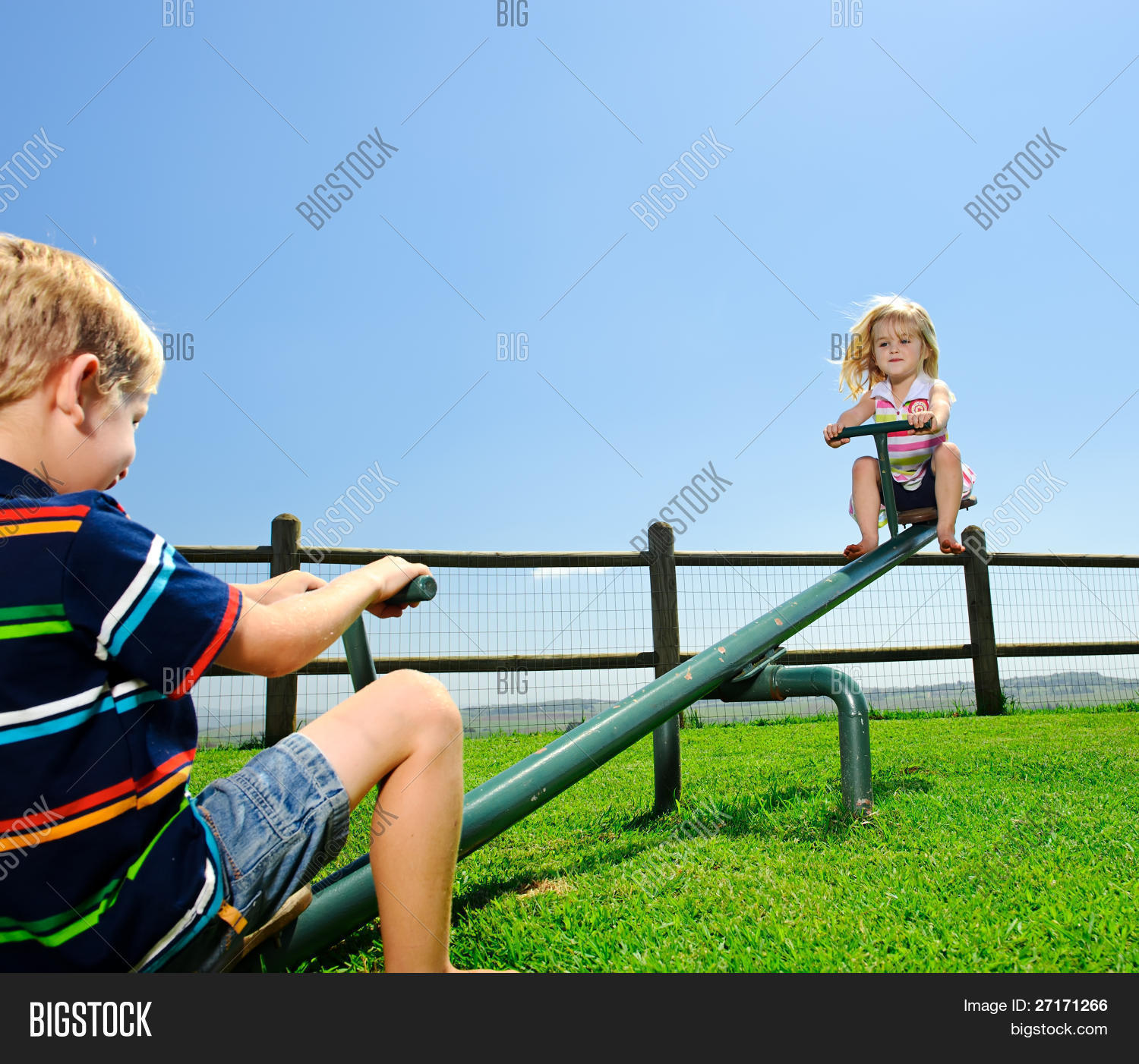 Kids Playing See-saw Image & Photo (Free Trial) | Bigstock