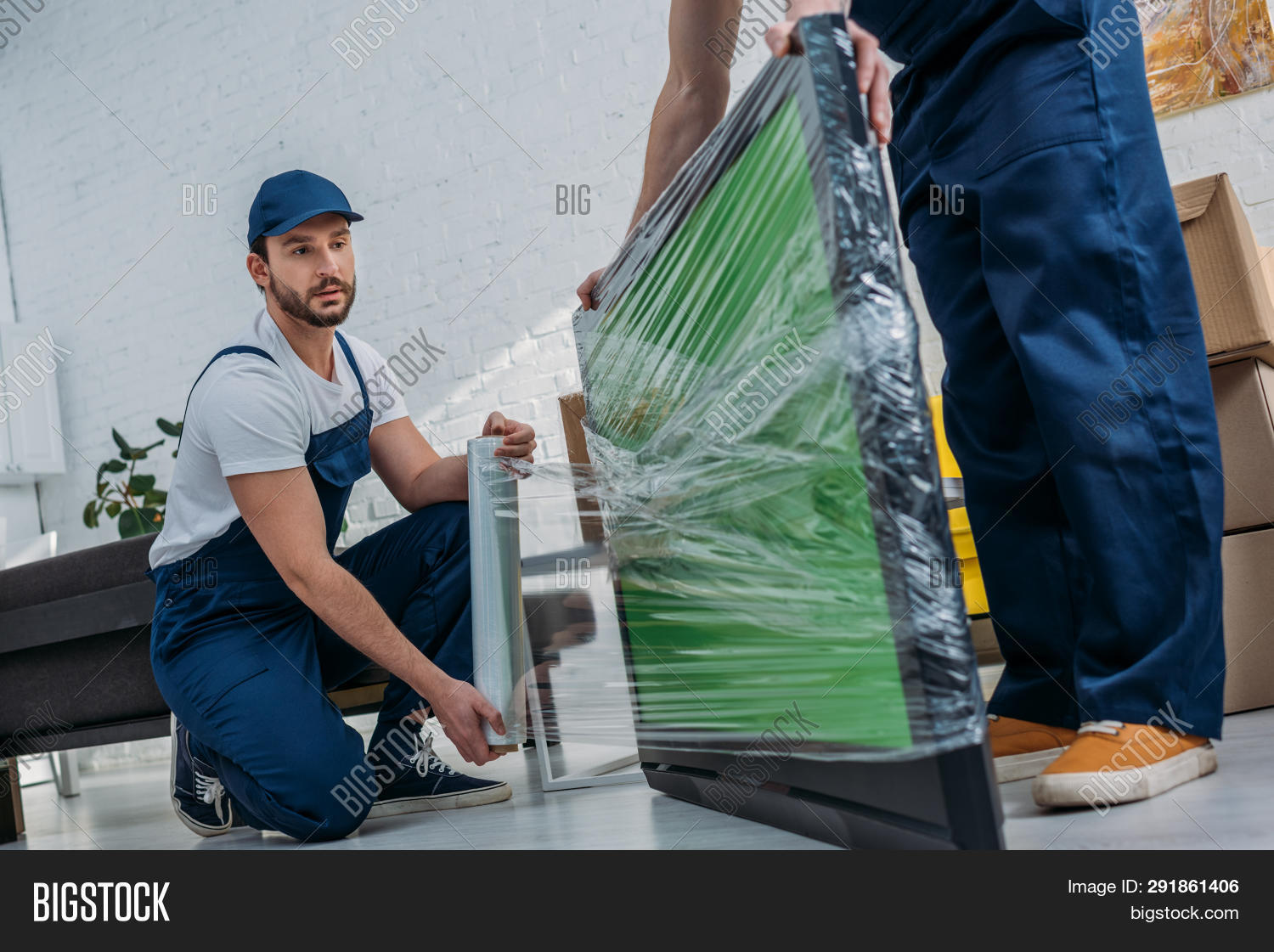 Two Movers Using Roll Image & Photo (Free Trial) | Bigstock