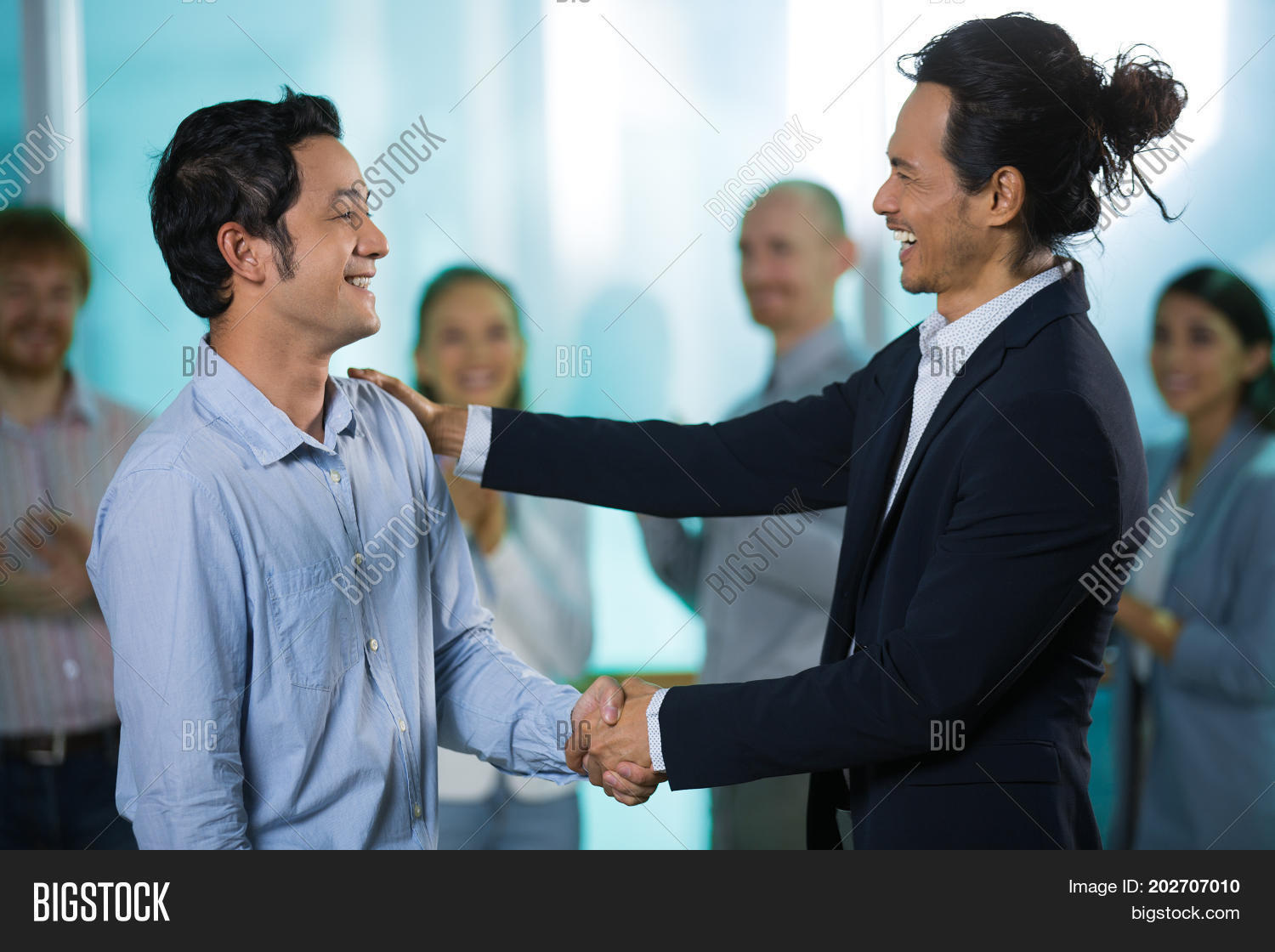 Employer And Employee Shaking Hands
