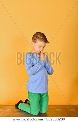 Boy Prays Kneeling, Image & Photo (Free Trial) | Bigstock