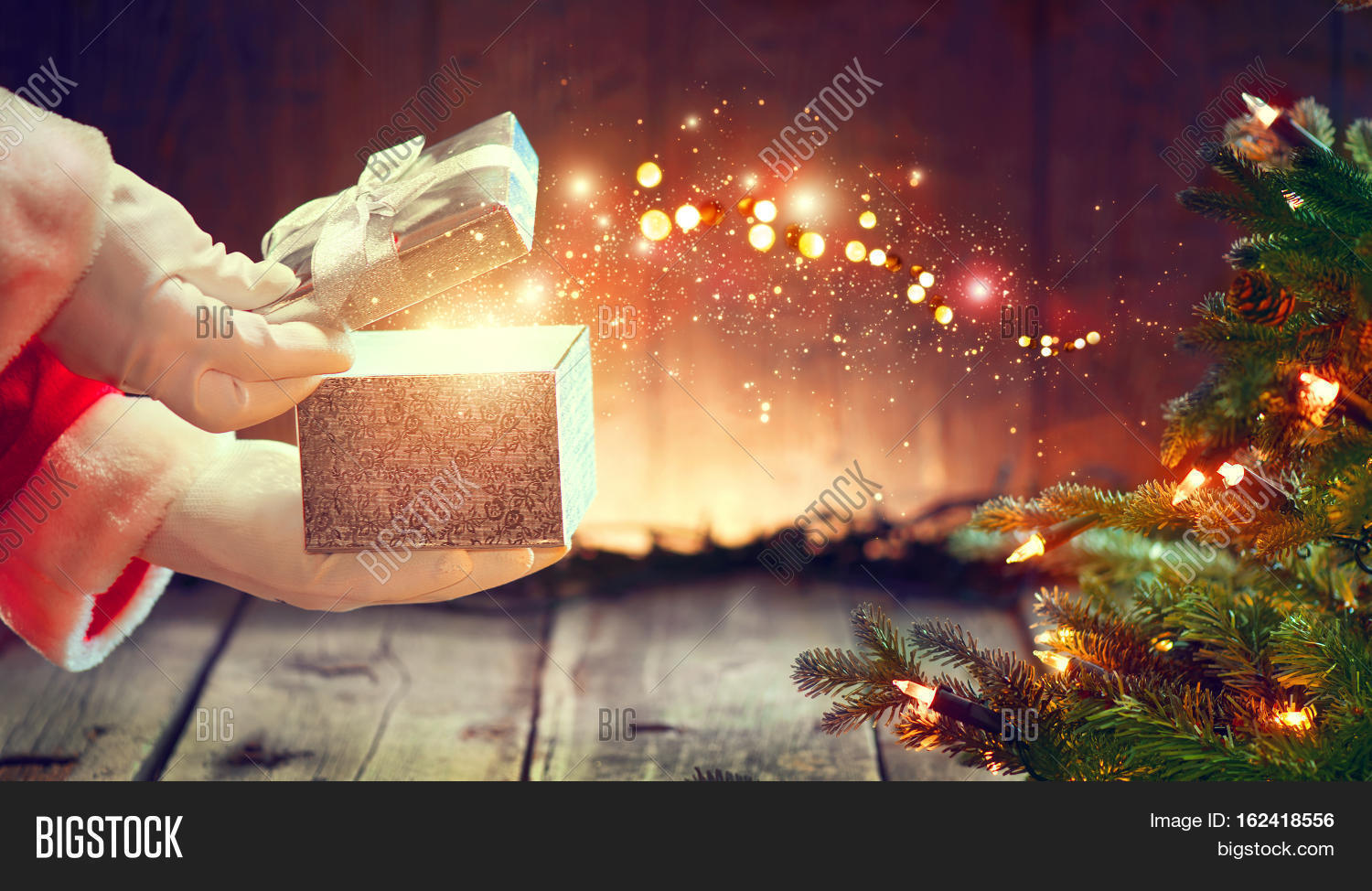 Santa Claus Opens Gift Image & Photo (Free Trial) | Bigstock