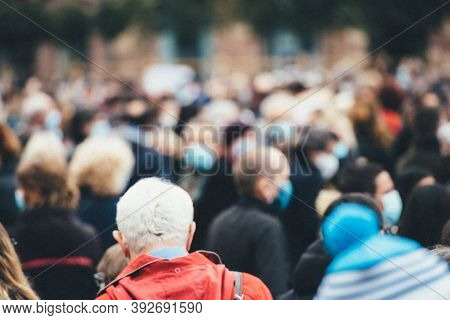 Rear View Of People Gathering At A Protest All Of Them Wearing ...