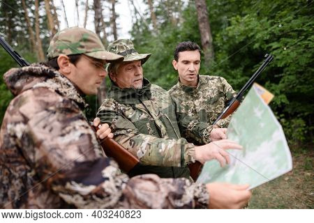 Hunters Watching Map Image & Photo (Free Trial) | Bigstock