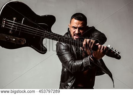 Aggressive Angry Man Breaks Guitar. Emotions, Aggression, Musical ...