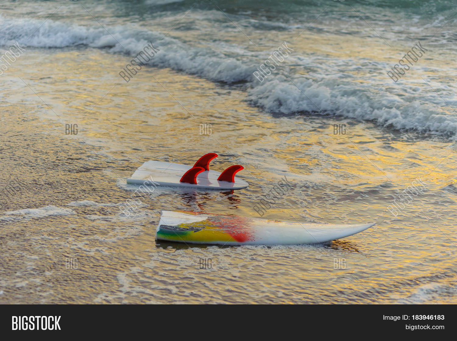 Broken Surfboard By Beach