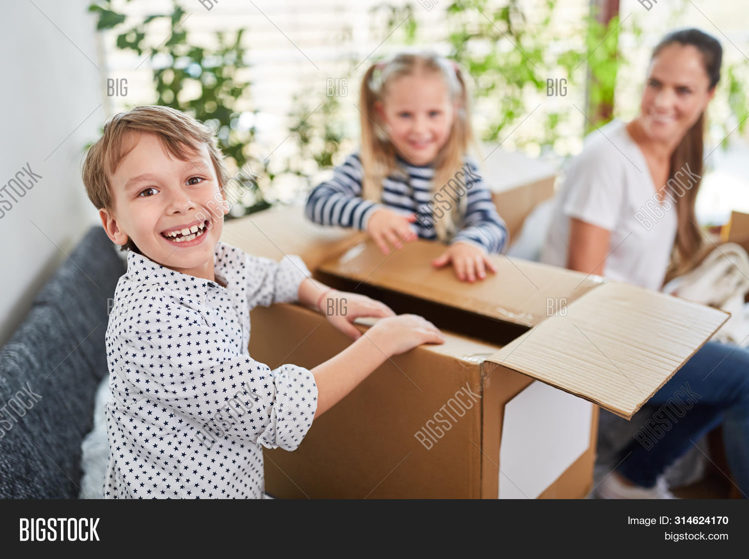 Happy Boy Helps Move Image & Photo (Free Trial) | Bigstock