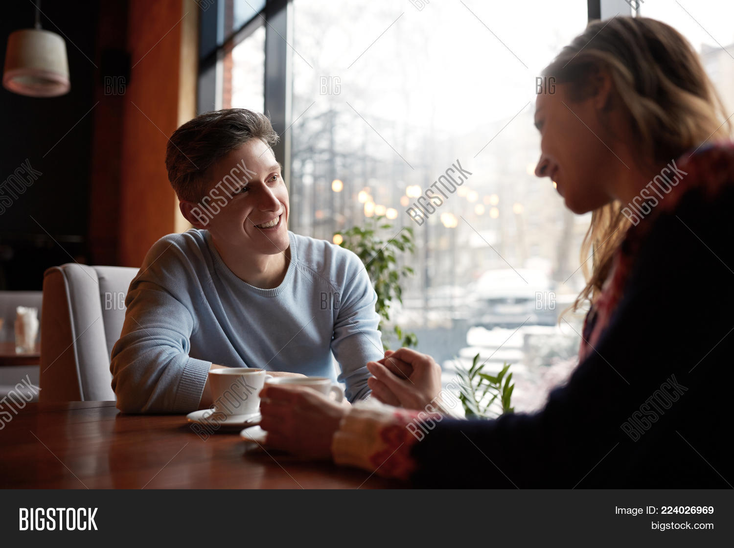 two men drinking coffee