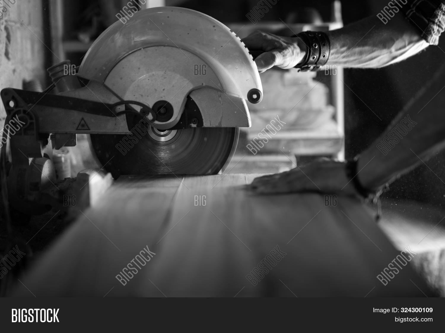 Man Sawing Wooden Beam Image & Photo (Free Trial) | Bigstock