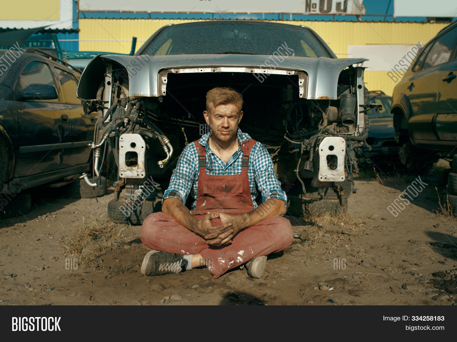 Male Mechanic Under Car