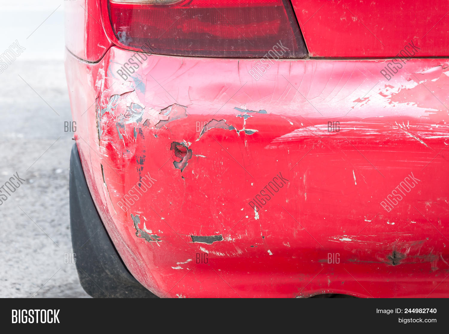 Damaged Red Car