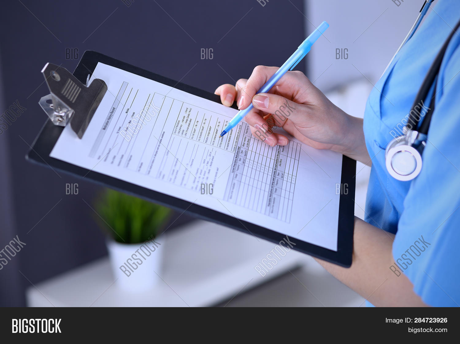 Female Doctor Filling Image & Photo (Free Trial) | Bigstock