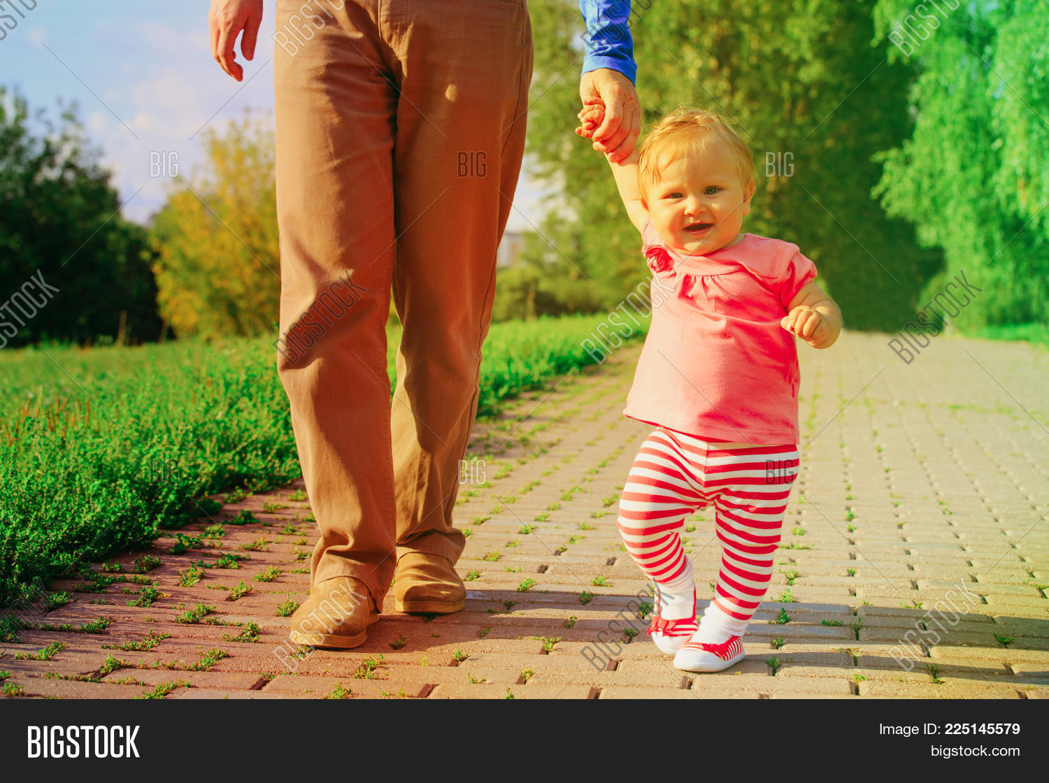 Little Girl Walking With Dad