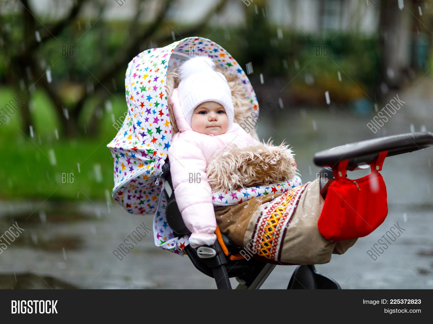 Little Girl Sitting In The Rain