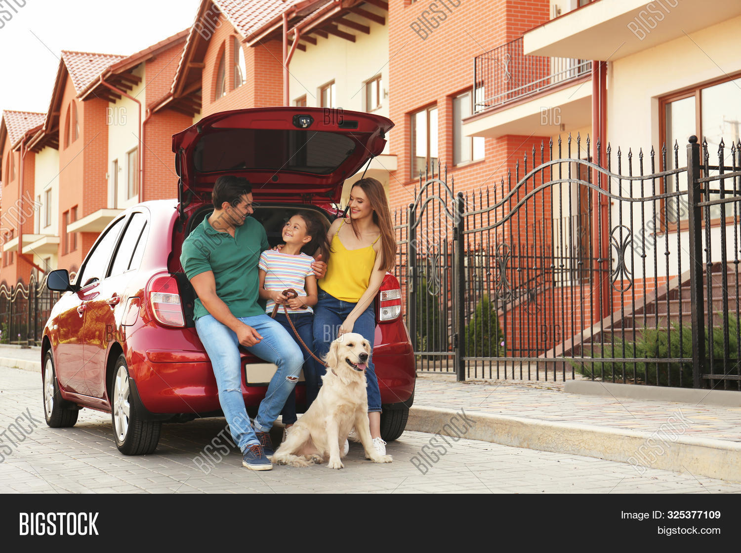 Happy Family With House And Car