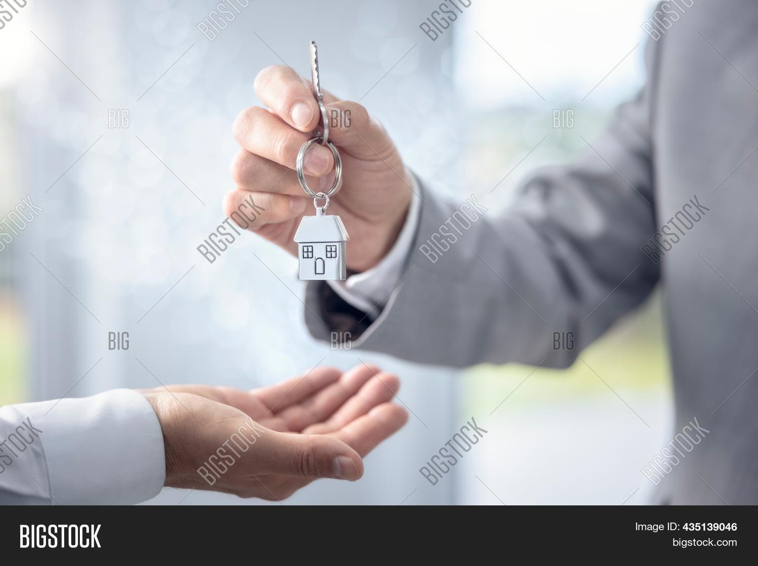 Holding House Keys On Image & Photo (Free Trial) | Bigstock