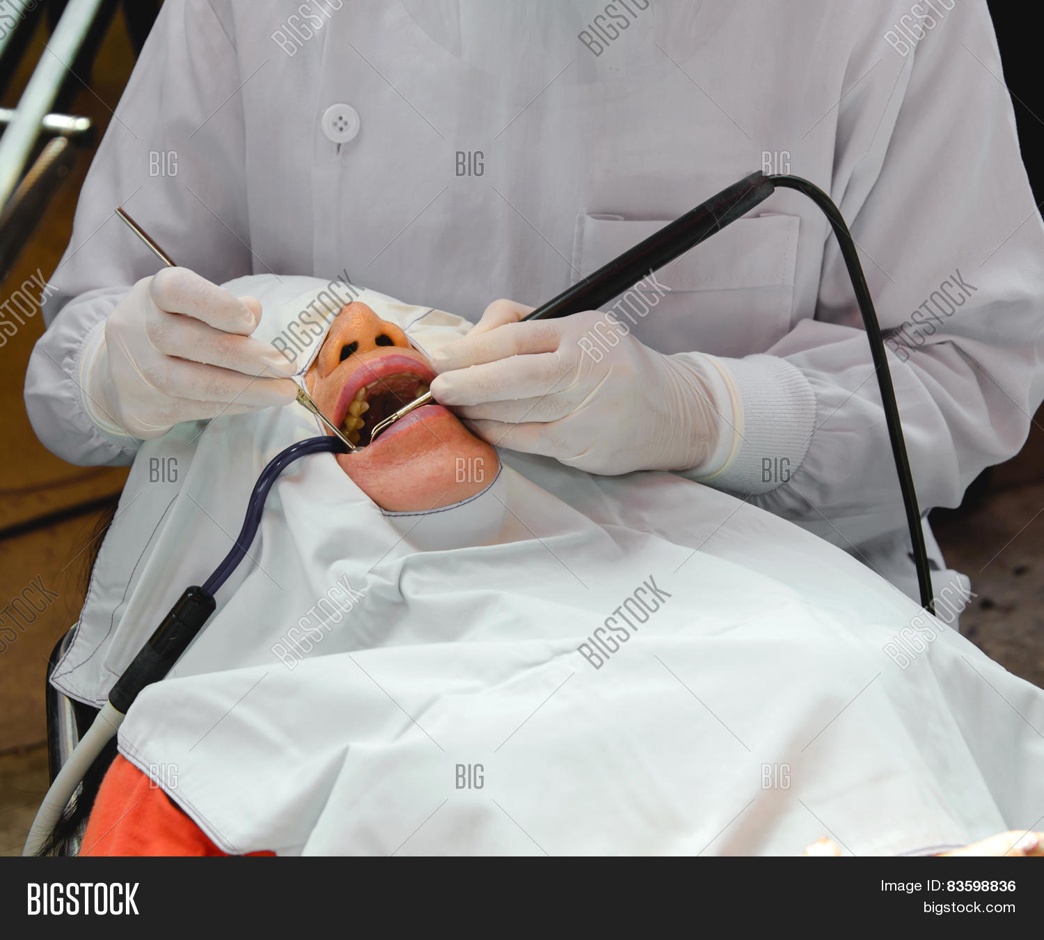 Doctor Cleaning Teeth Image & Photo (Free Trial) | Bigstock