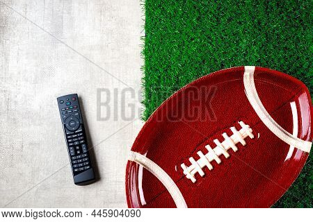 Symbol Of American Football Ball Plate With Remote Controller On White ...