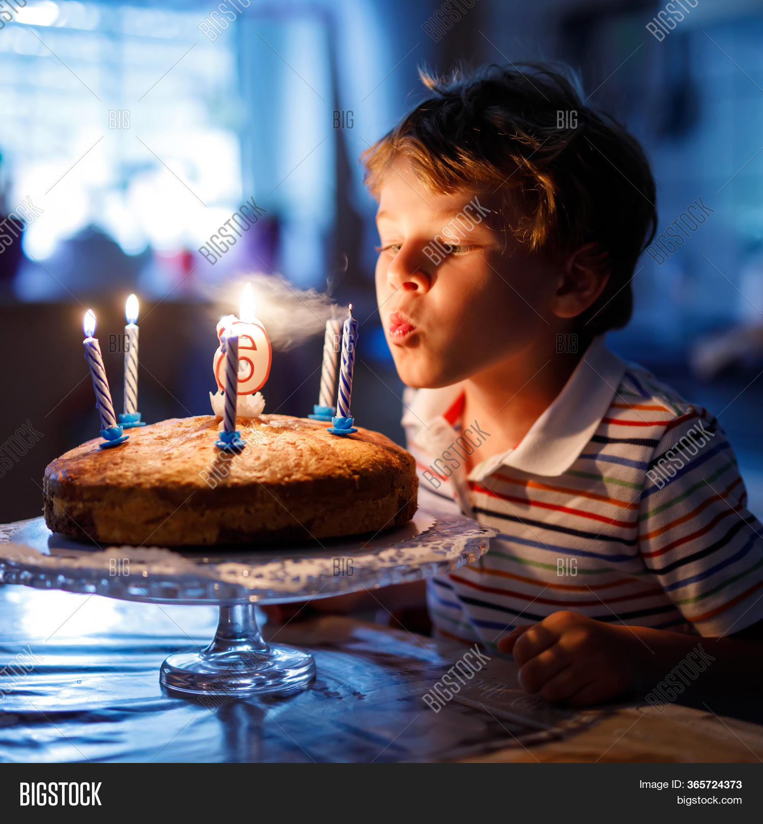 Child Blowing Out Candles