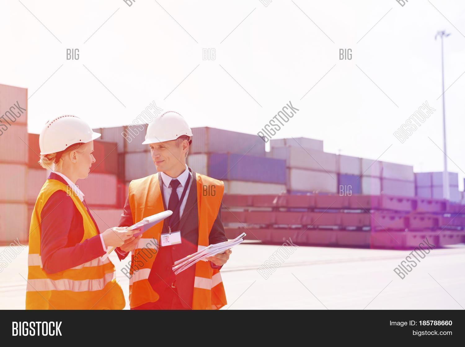 Workers Discussing Image & Photo (Free Trial) | Bigstock