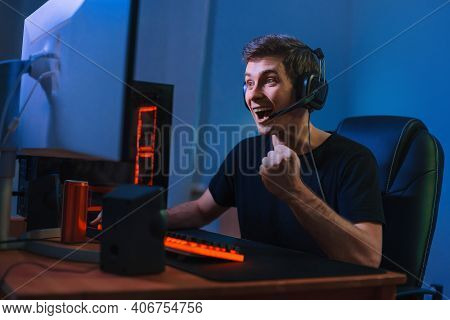 Young Caucasian Pro Gamer Win In Online Video Game, Feels Happy And ...