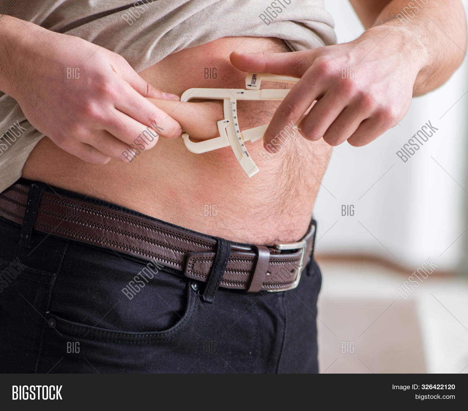 Man Measuring Body Fat Image & Photo (Free Trial) | Bigstock