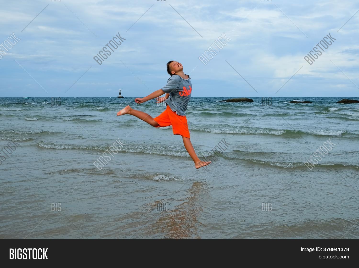 Cute Boy Jumping High Image & Photo (Free Trial) | Bigstock