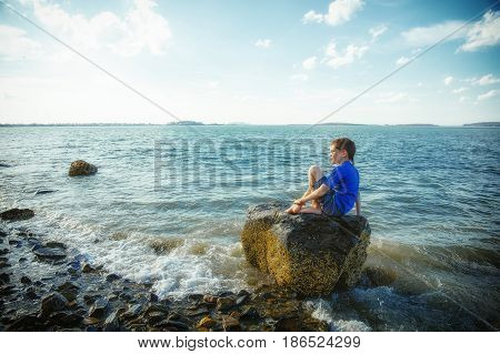 Boy Sitting On Rock By Image & Photo (Free Trial) | Bigstock