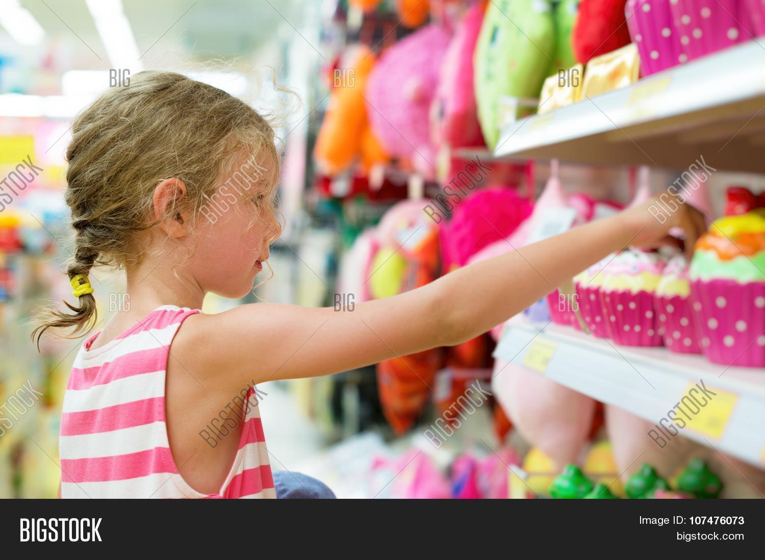 Little Girl Selecting Image & Photo (Free Trial) | Bigstock