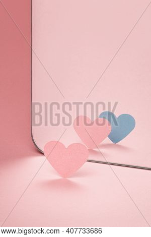 Pink Paper Heart In Front Of A Mirror. Two Hearts In Reflection ...