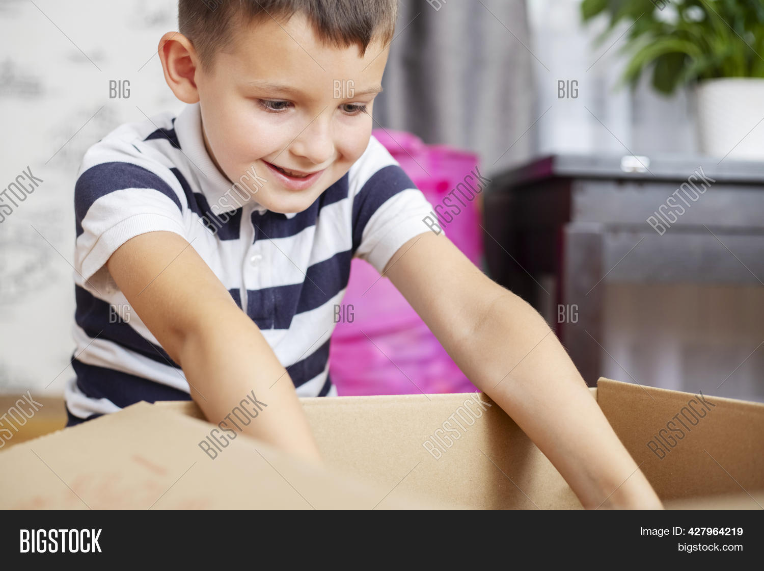 Boy Unpacking Image & Photo (Free Trial) | Bigstock