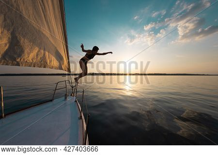 Woman Jumping Into Water Images, Illustrations & Vectors (Free) - Bigstock
