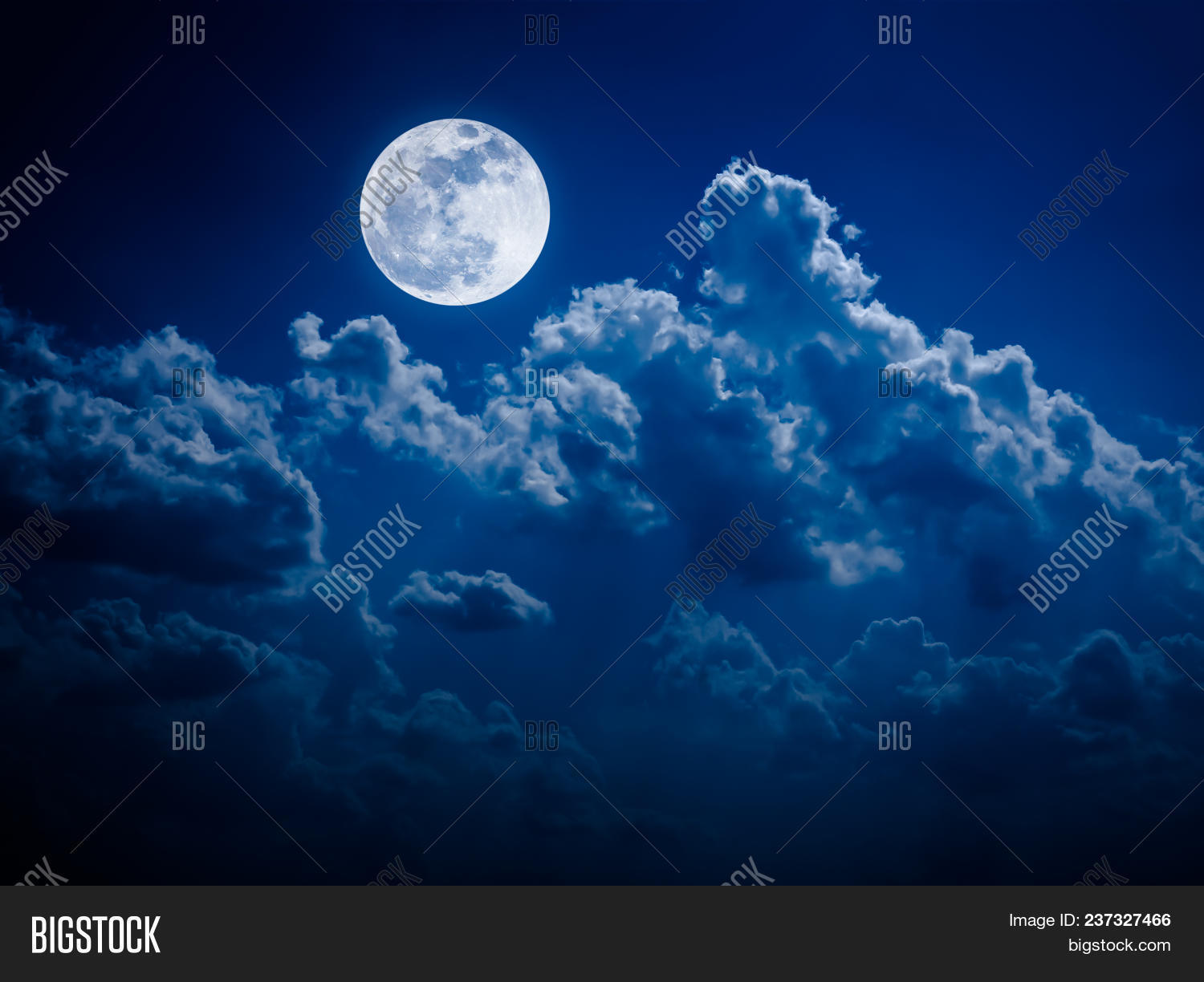 Cloudy Blue Night Sky With Moon