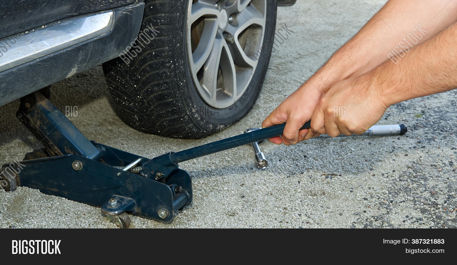 Man Changing Wheel. Image & Photo (Free Trial) | Bigstock
