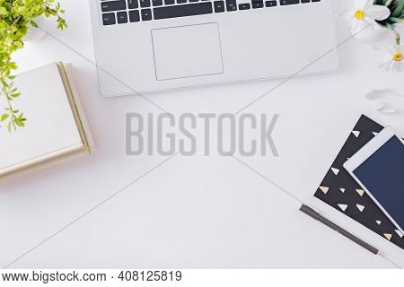 Flat Lay Blogger Or Freelancer Workspace With A Laptop, Spring Flowers ...