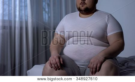 Fat Man Sitting On Bed Image & Photo (Free Trial) | Bigstock