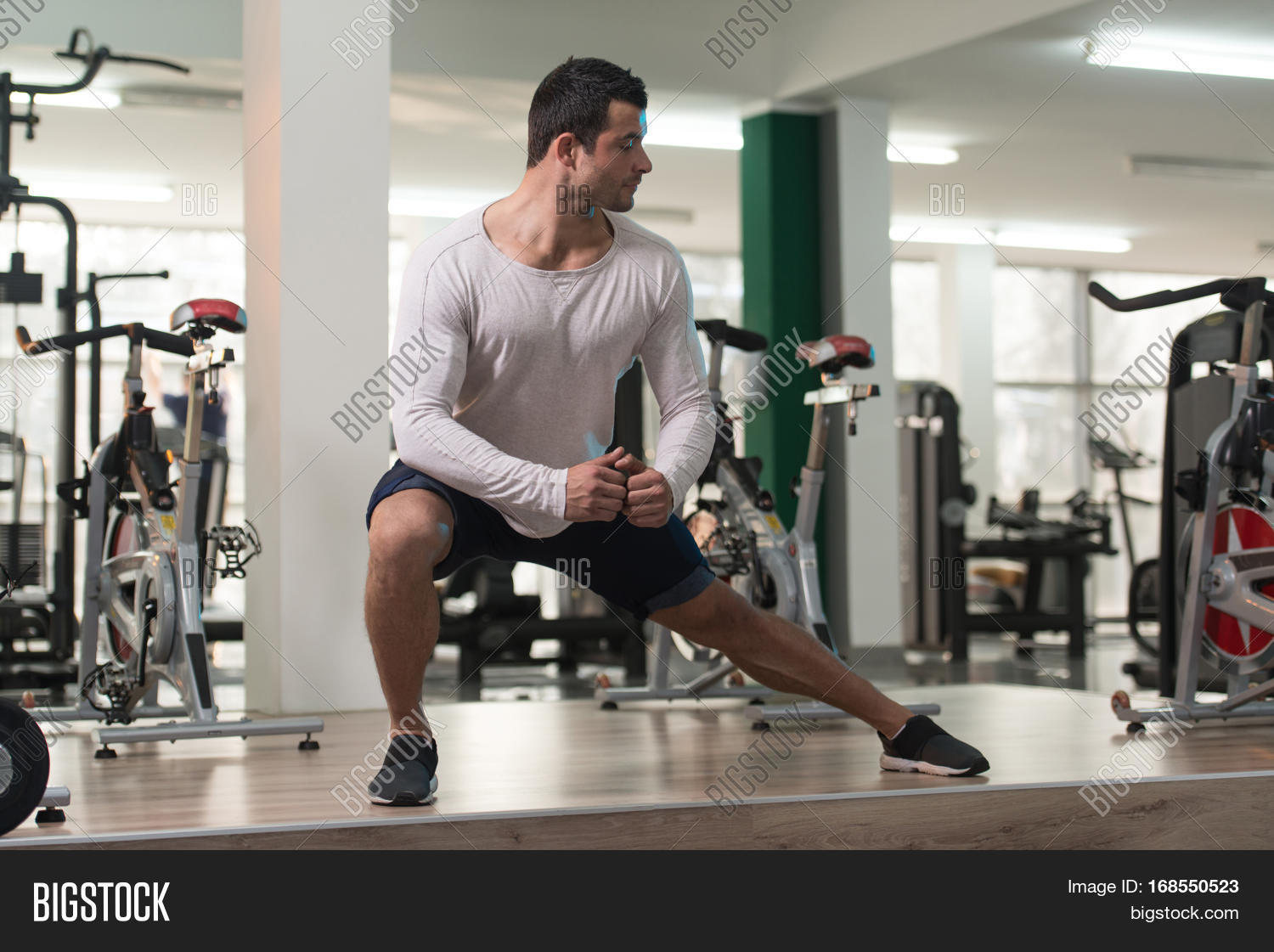 Fitness Man Stretches Image & Photo (Free Trial) | Bigstock