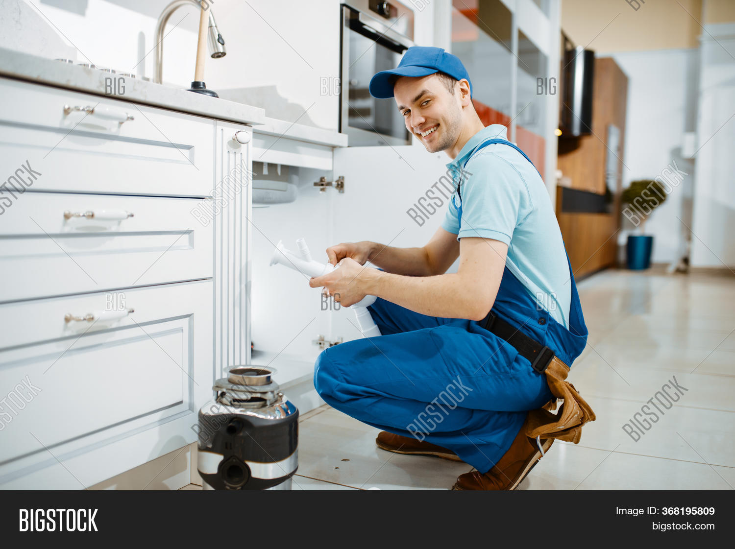 Smiling Male Plumber Image & Photo (Free Trial) | Bigstock
