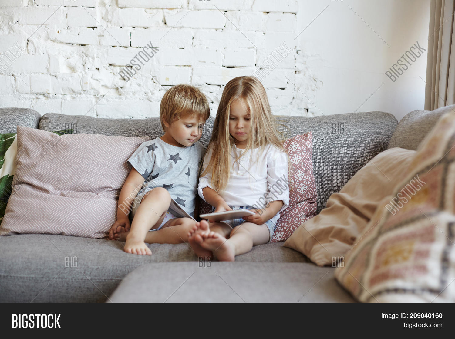Two Siblings Using Image & Photo (Free Trial) | Bigstock