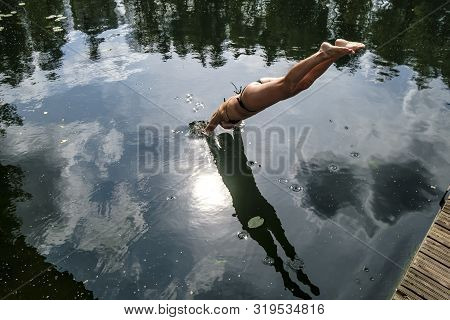 Woman Diving Into Water Images, Illustrations & Vectors (Free) - Bigstock