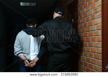 Officer Escorting Image & Photo (Free Trial) | Bigstock