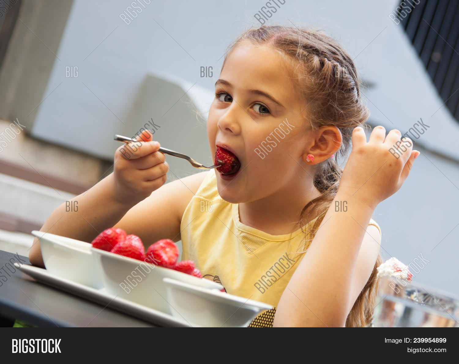 Happy Child Girl Eats Image & Photo (Free Trial) | Bigstock